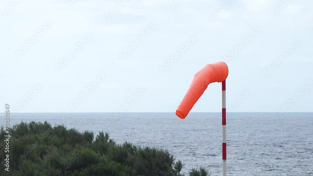Windsock blow in wind to show speed and direction of wind gusts ...
