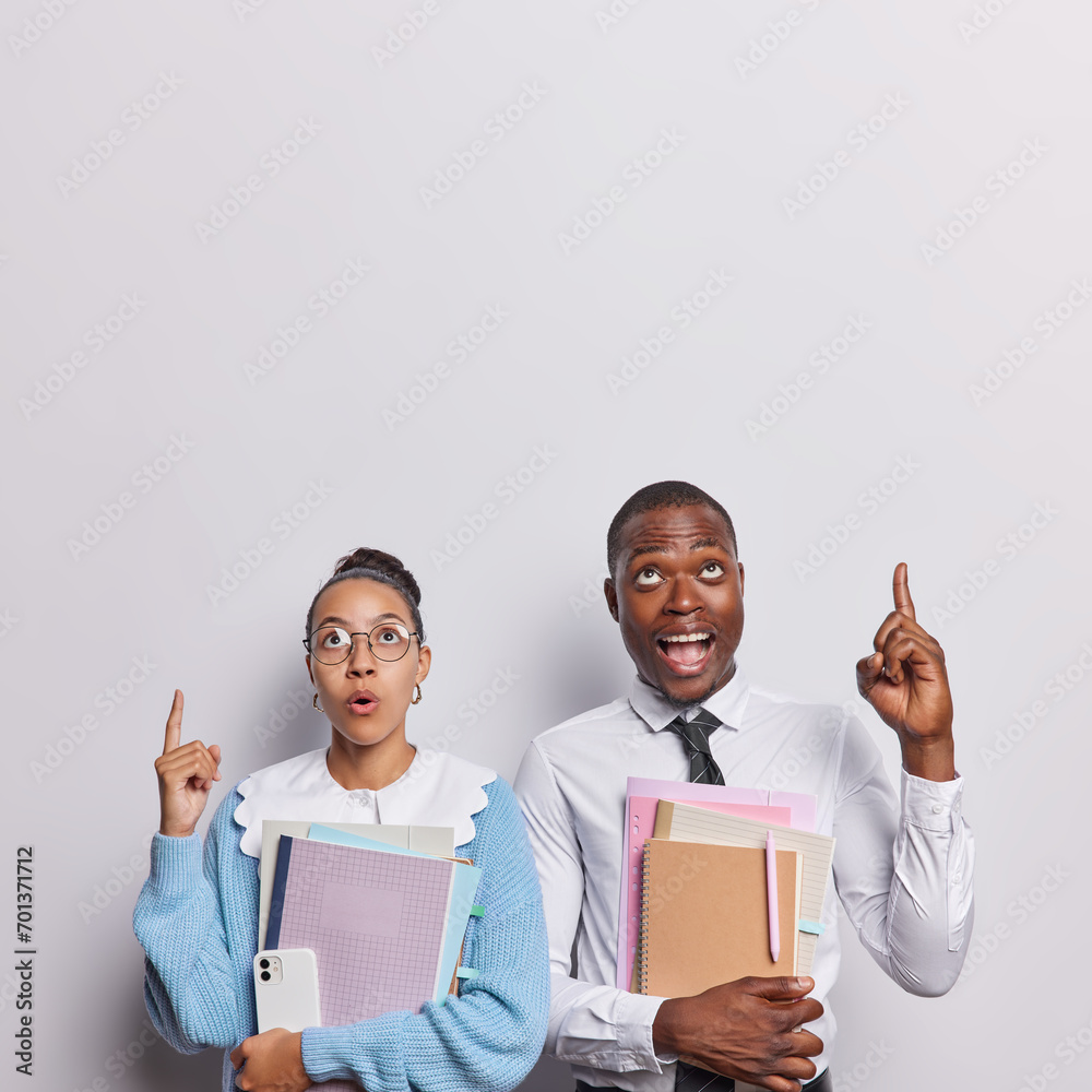 High school students pose with notepads and textbooks points index ...