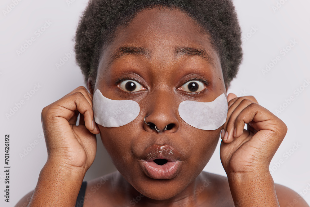 Beauty and cosmetology concept. Studio shot of young surprised African ...