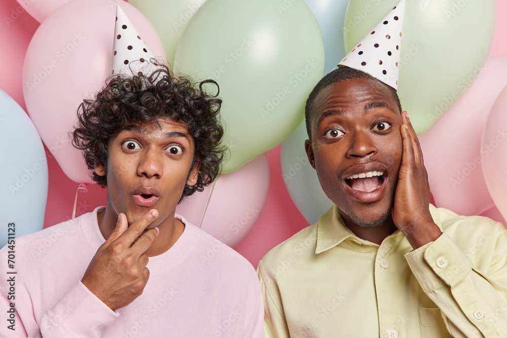 Joyous birthday celebration. Positive two men stare impressed have ...