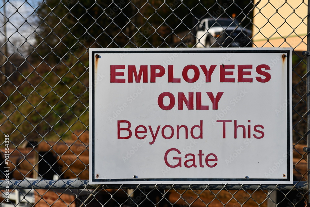 Employees only sign on gate. Stock Photo | Adobe Stock