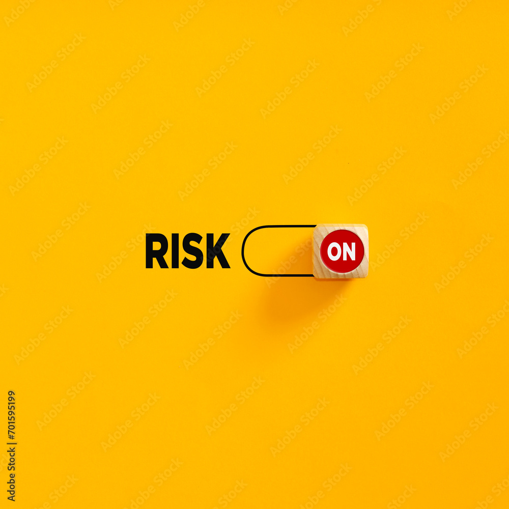 Risk on slider button on yellow background. Risk taking or risk ...
