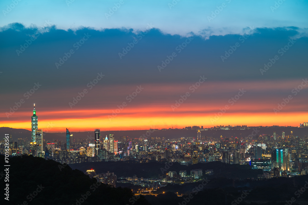 In serene sunset tones, stunning views of the Taipei skyline are ...
