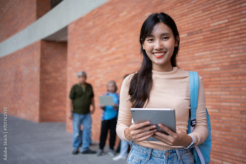 Young and cute Asian college student girls smile carrying a backpack ...