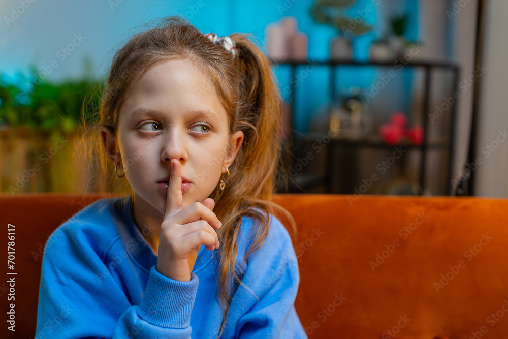 Shh be quiet please. Preteen child girl presses index finger to lips ...