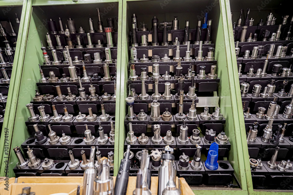 Mills and cutting tools for working on a CNC machine are arranged. in ...