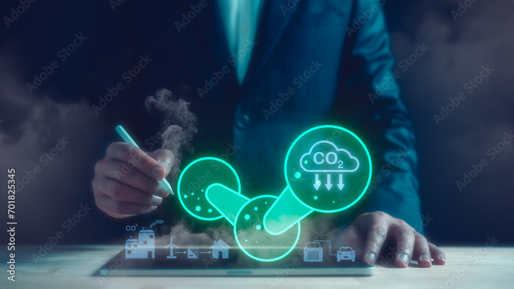 Businessman use tablet and pen work with co2 diagram and smoke ...