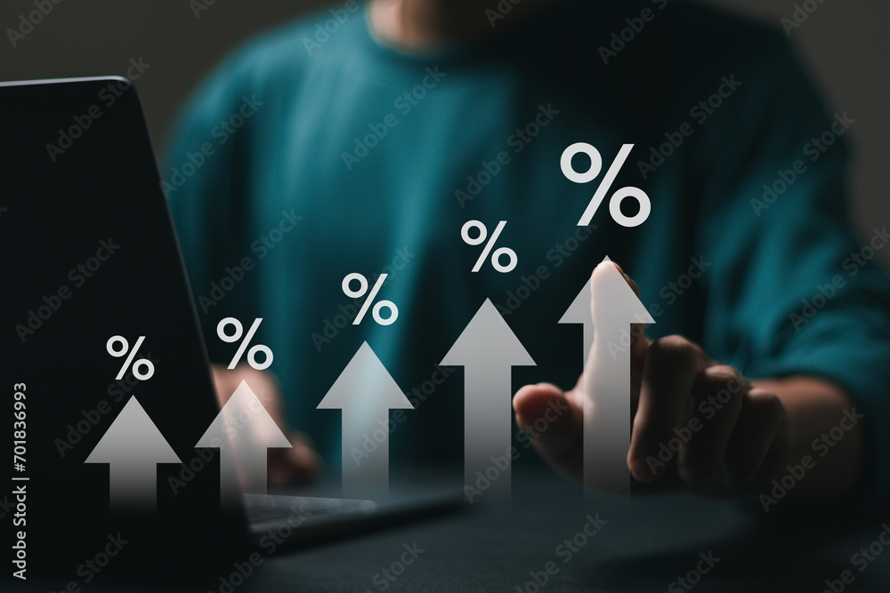 Interest rate and dividend concept, businessman use laptop with ...