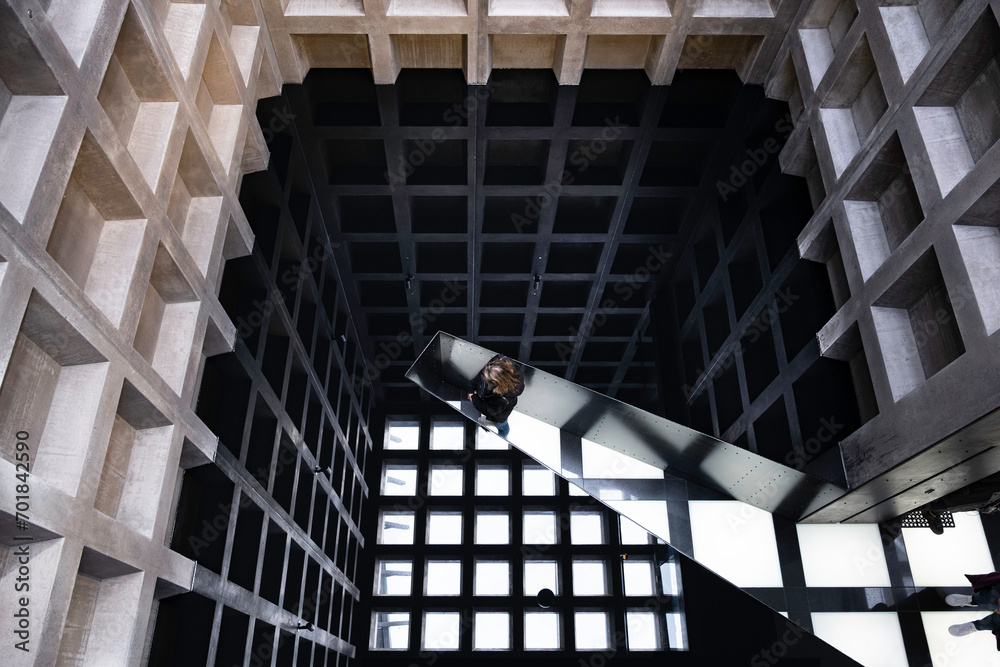 Woman walks gingerly in an art installation over oil at the MONA Museum ...