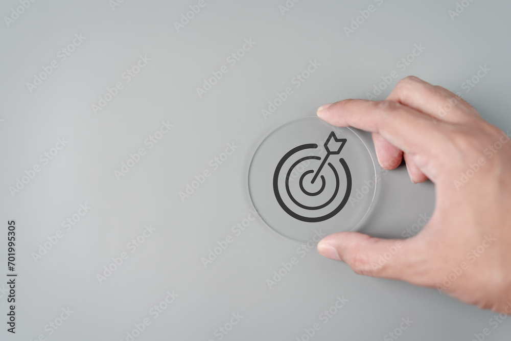 Hand holding Target icon which for planning development leadership and ...