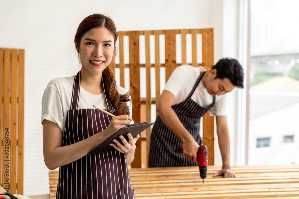 Cafe Owners Renovate Kitchen, Female Writing Notes For Build As Male ...