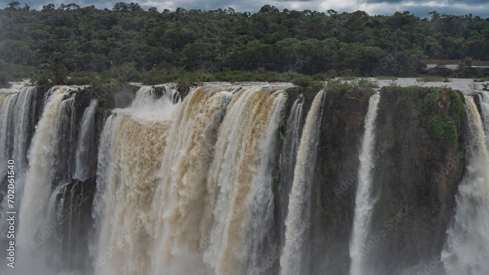 A fragment of a tropical waterfall. Streams of foaming water collapse ...