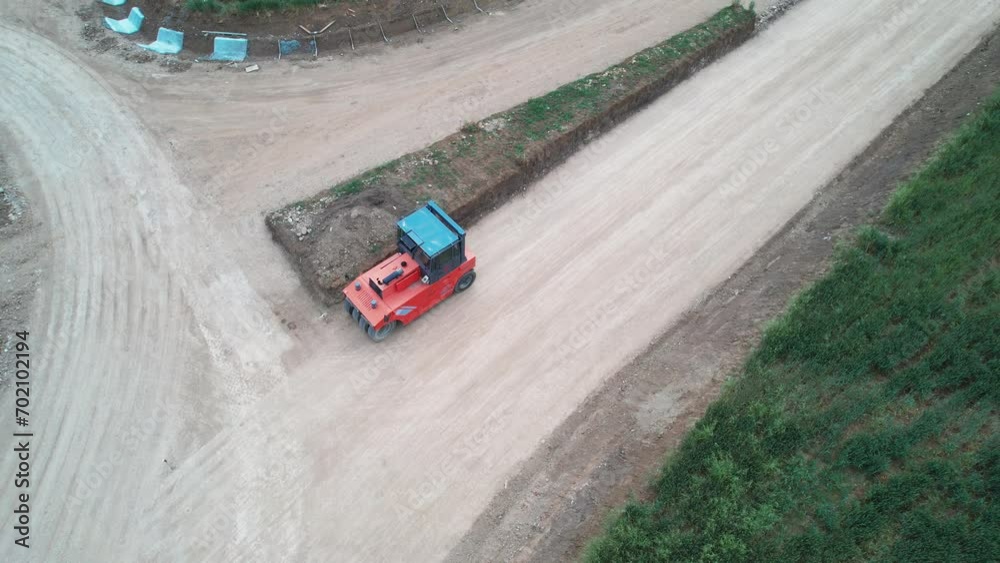 Rubber wheel of asphalt compactor drive on road construction site ...