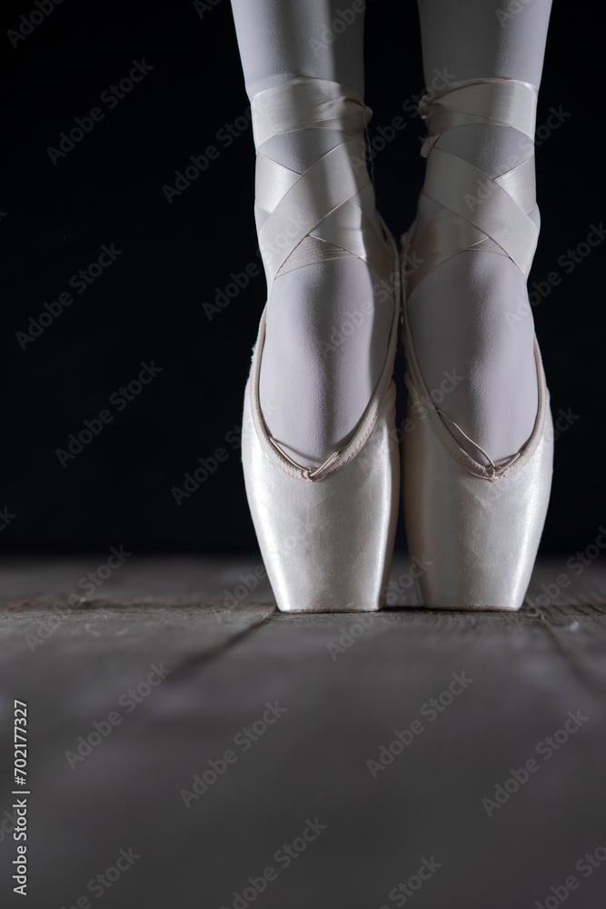 detail of female ballet dancer's foot in ballet position with pointe ...