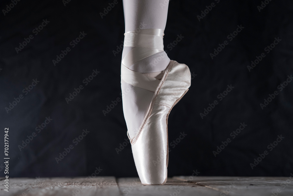 detail of female ballet dancer's foot in ballet position with pointe ...