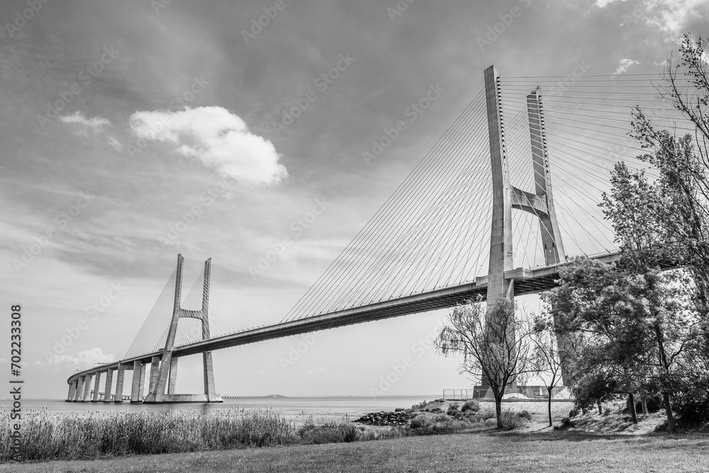 Vasco da Gama bridge in Lisbon, Portugal; cable stayed bridge flanked ...