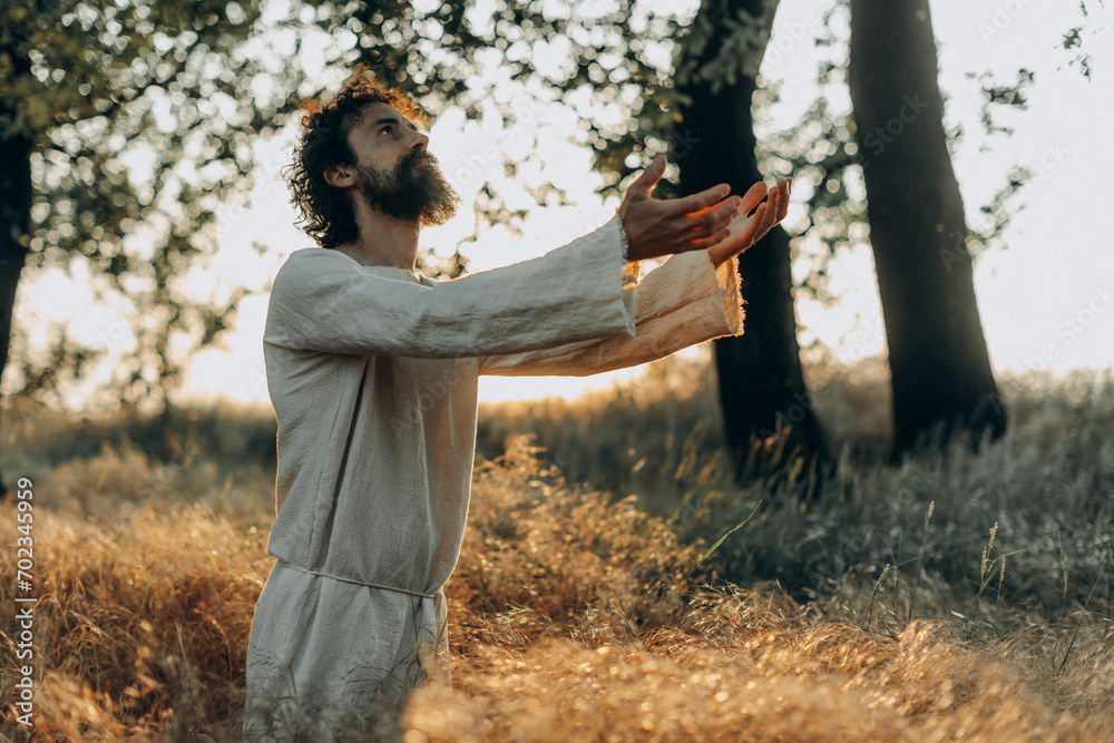 Jesus Christ Alone in the Garden, Meditating and Praying Stock Photo ...