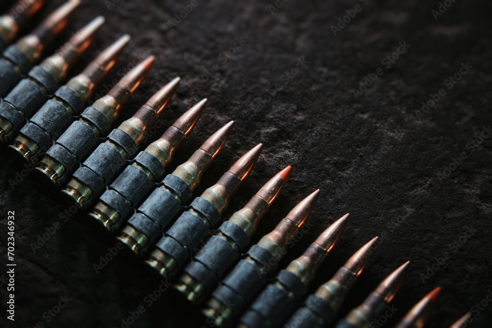 Machine gun bullet belt on the floor. Background on the military theme ...
