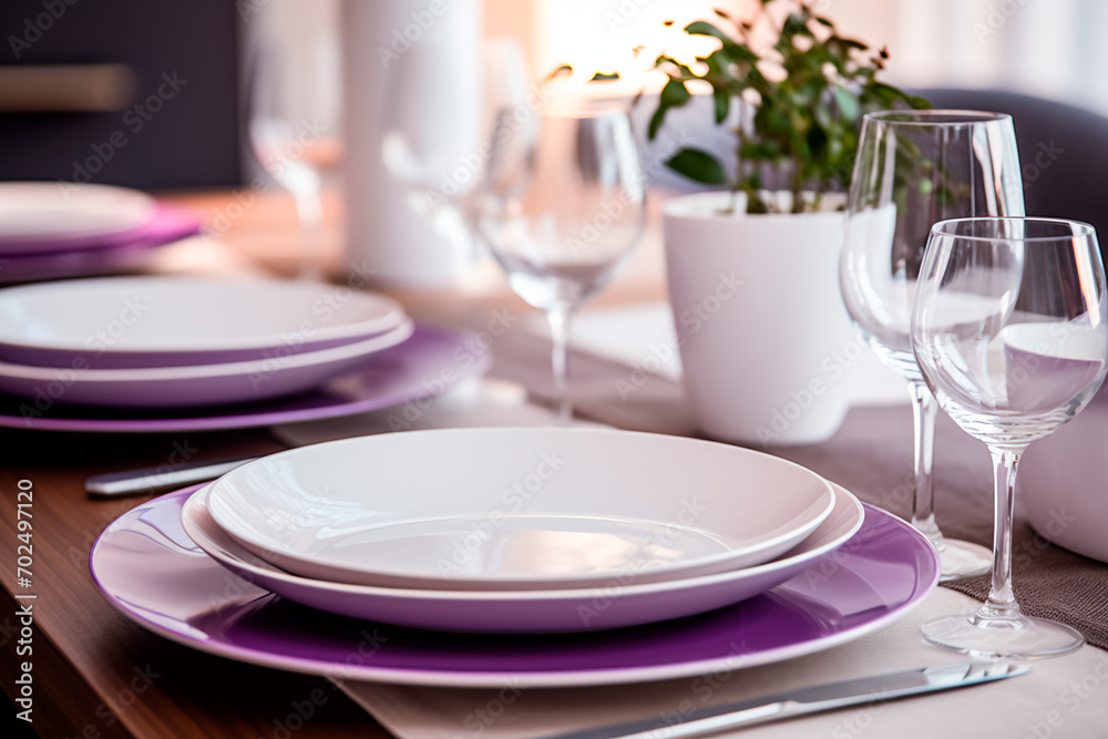 The dining table at home is set with a combination of white and purple ...