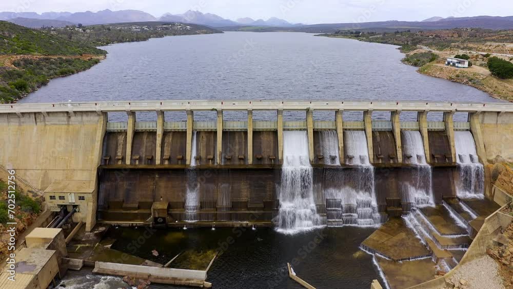 Drone, dam with water and wall for infrastructure, industrial landscape ...