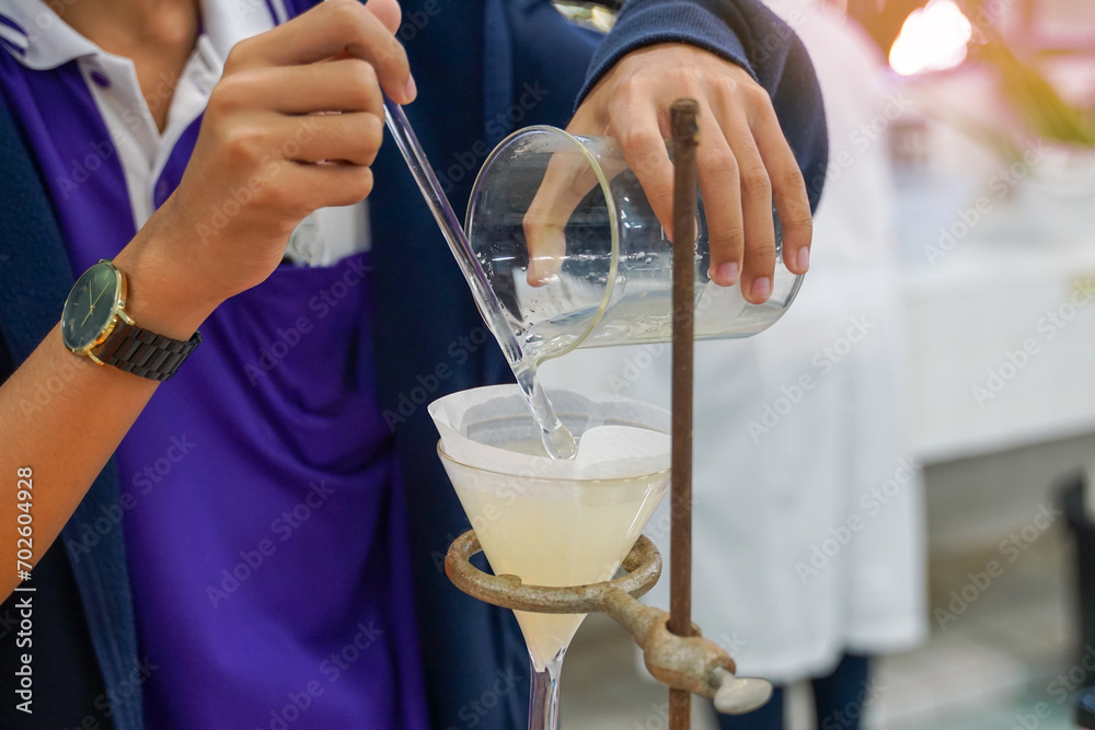 Experiment to separate mixed substances by pouring substances into a ...