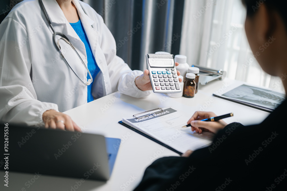Healthcare costs and fees concept.Hand of smart doctor used a ...