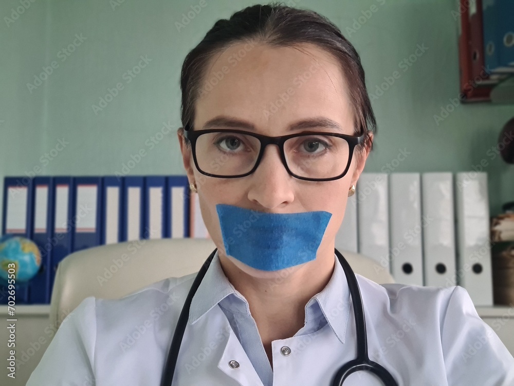 Doctor with tape and mouth taped. Medical confidentiality and non ...