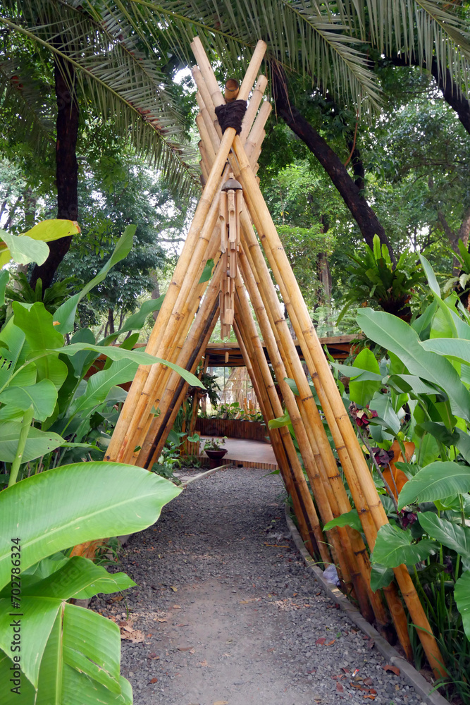 Bamboo bridge with unique traditional lights and woven bamboo as ...