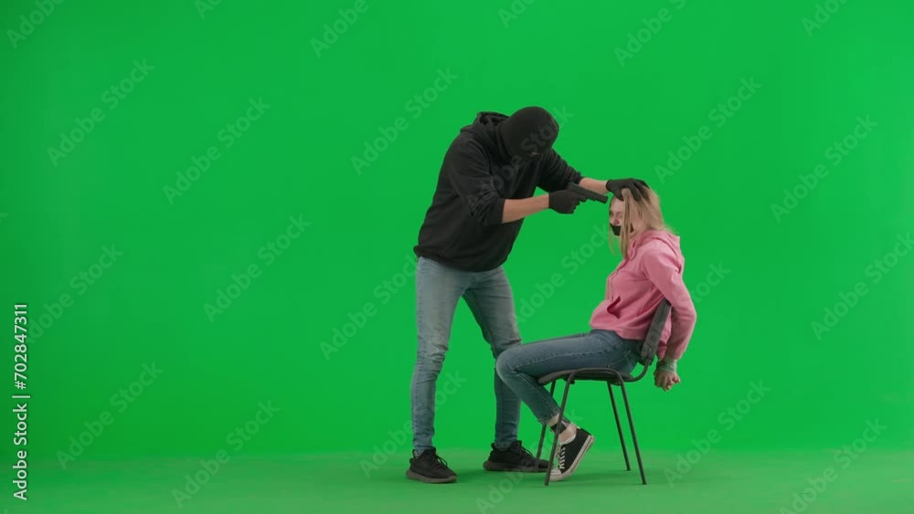 Portrait of thief and victim on chroma key green screen background ...