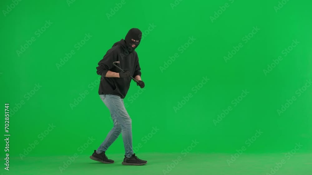 Vidéo Stock Portrait of thief on chroma key green screen background ...