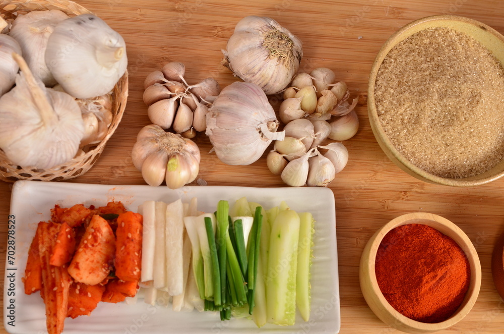 vegetables, fruits, and various cooking ingredients are lined up ...