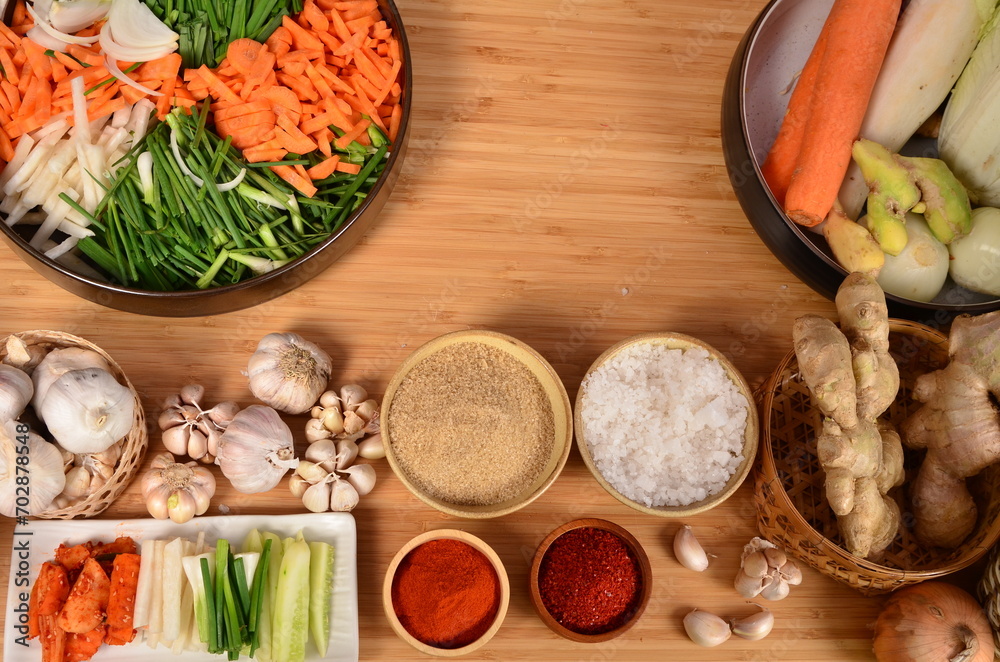 vegetables, fruits, and various cooking ingredients are lined up ...