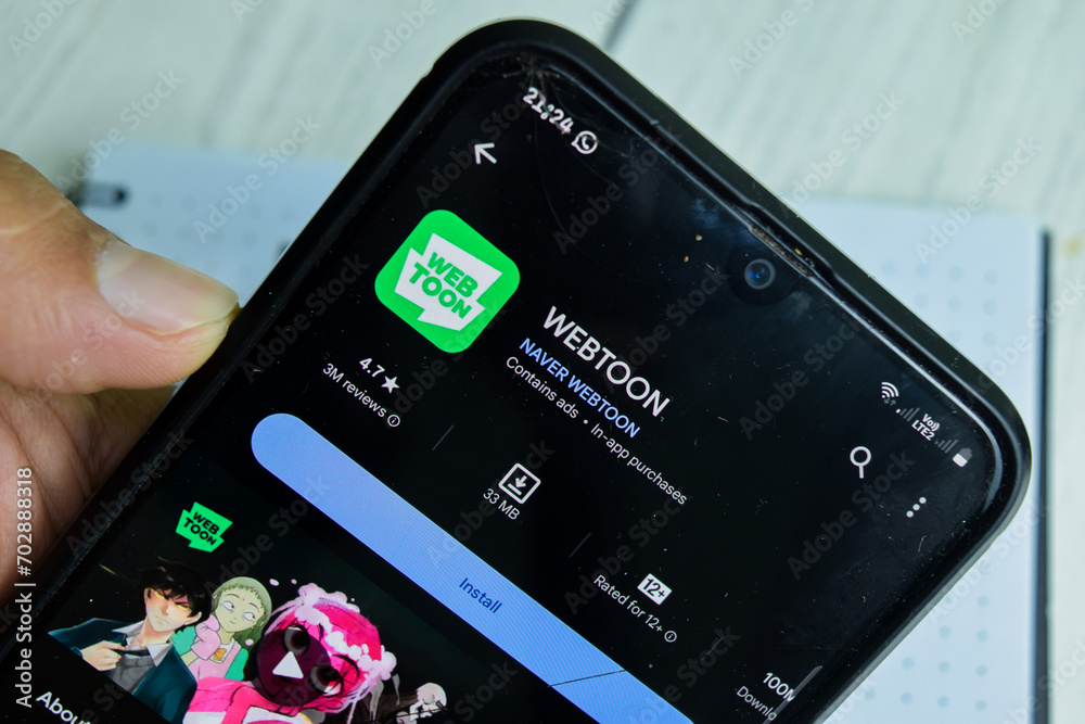 Webtoon application on Smartphone screen. Webtoon is a freeware web ...