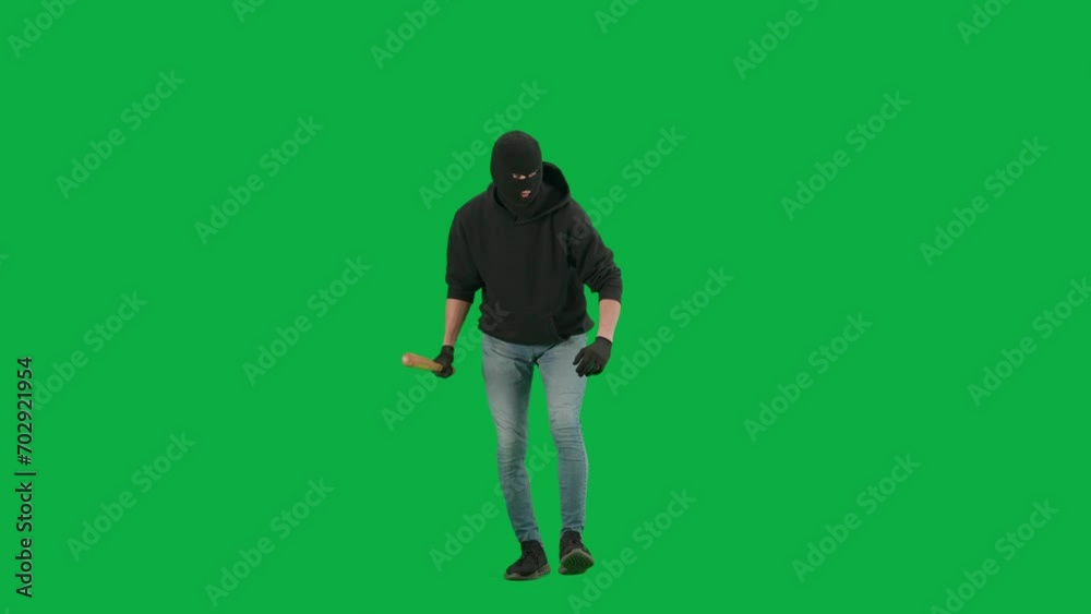 Portrait of thief on chroma key green screen background. Man robber in ...