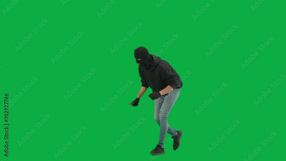 Vidéo Stock Portrait of thief on chroma key green screen background ...
