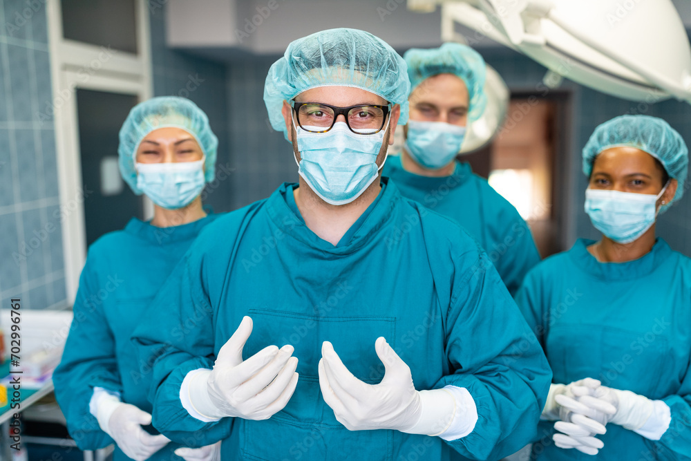 Group of medical professionals standing and looking at camera in ...