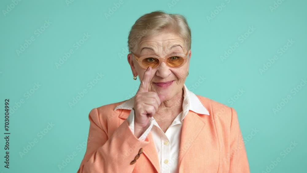 Nice positive well-groomed lady over 60 with a light smile wearing ...