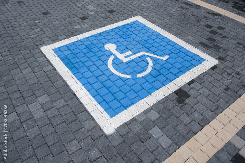 road markings designate a parking space for driver with limited ...