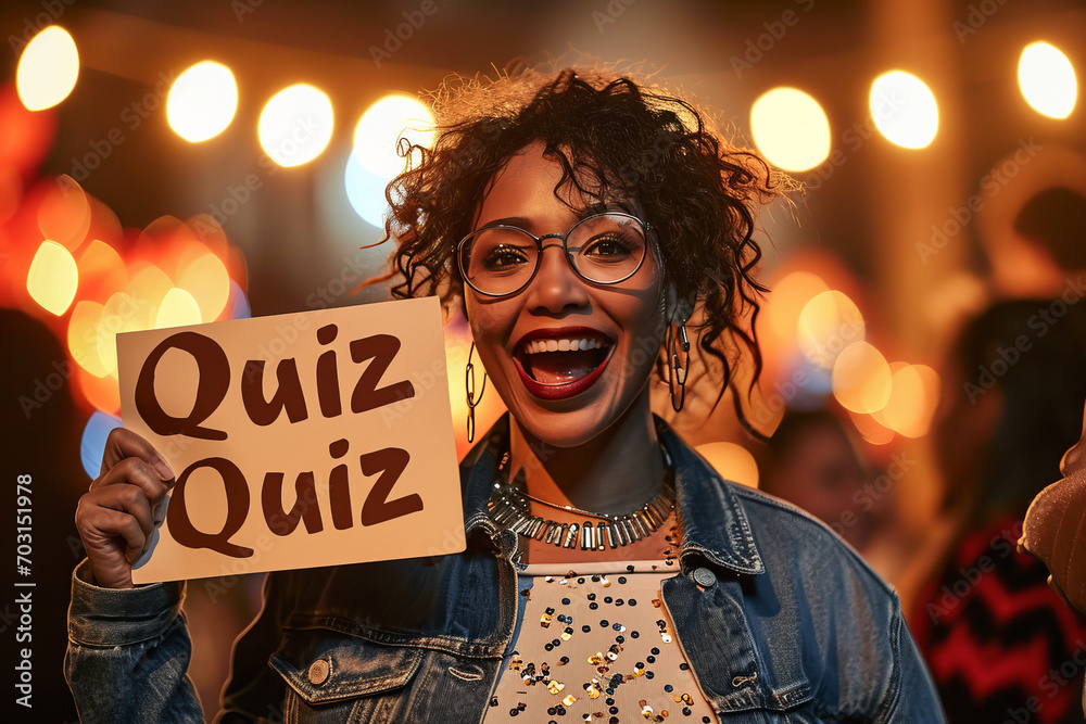Quiz concept image with happy woman holding a board sign with written ...