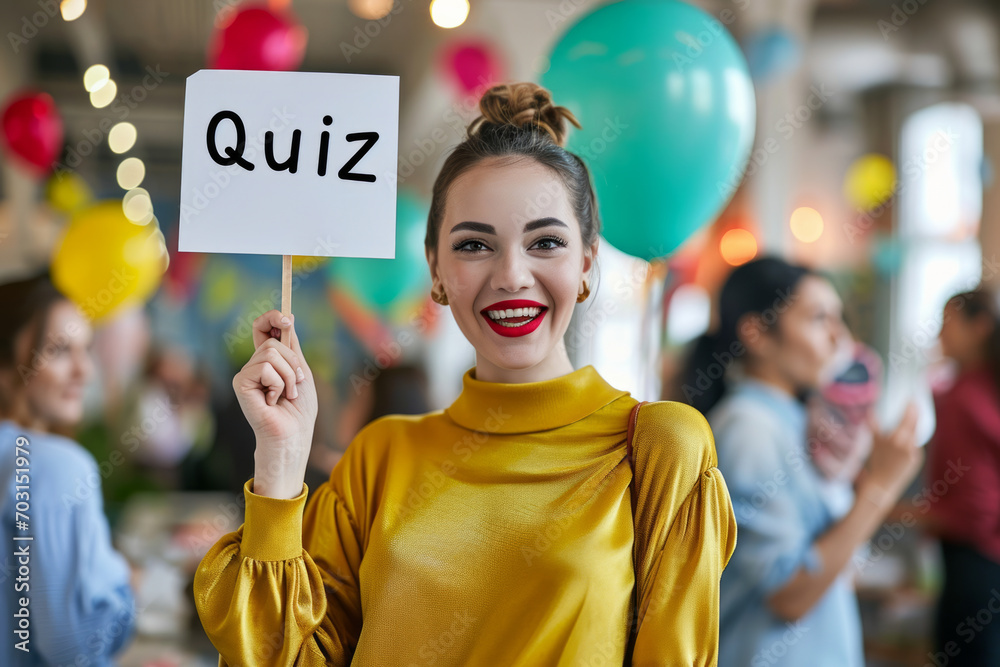 Quiz concept image with happy woman holding a board sign with written ...