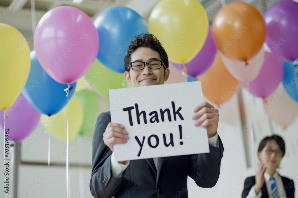 Thank you concept image with a business man manager holding a sign with ...