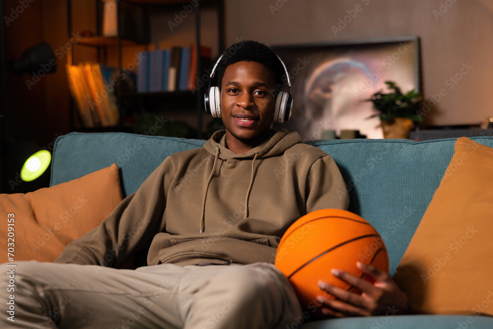 Attractive handsome basketball player at weekends sitting in his ...