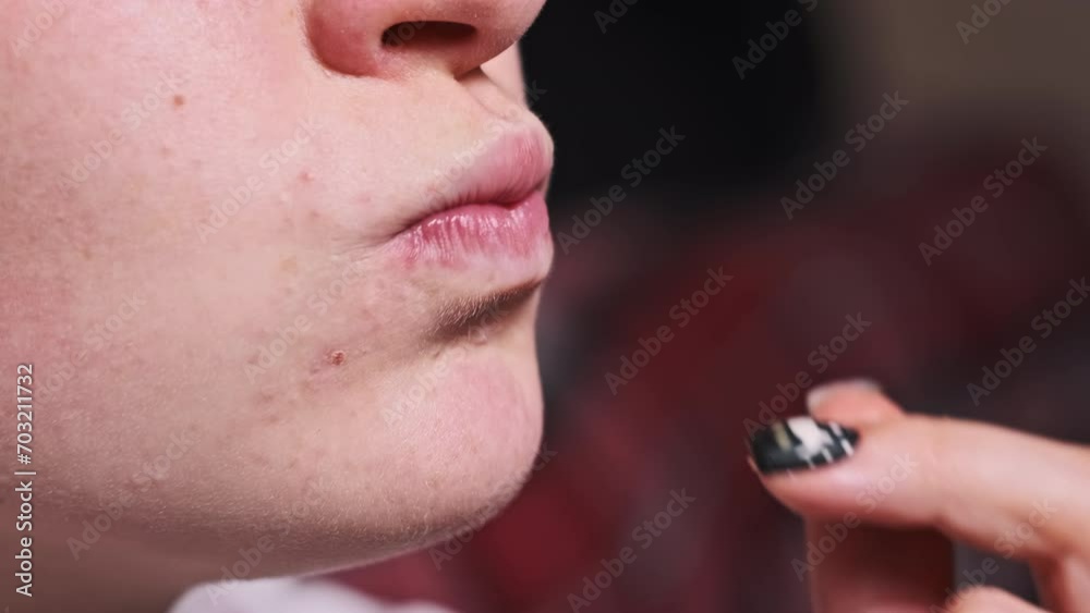 Young woman mouth eating potato chips close-up in slow motion. The ...