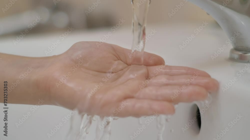 Slow Motion. Closeup of Human Hand Under Stream of Pure Water From Tap ...