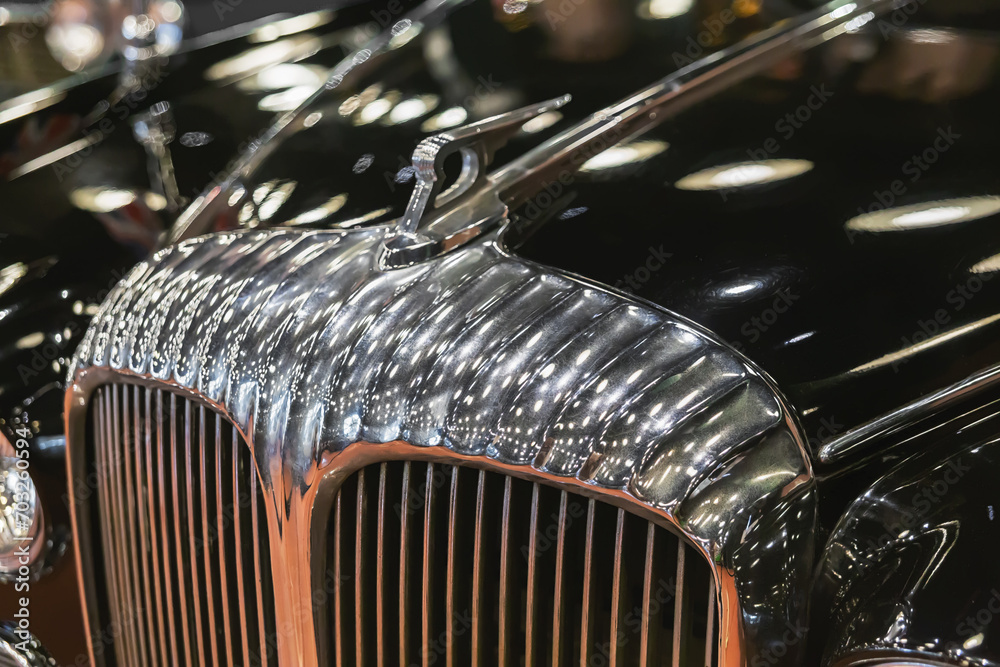 The front of a 1979 Daimler DS420 Limousine with mascot on the bonnet. Close up fragment ...
