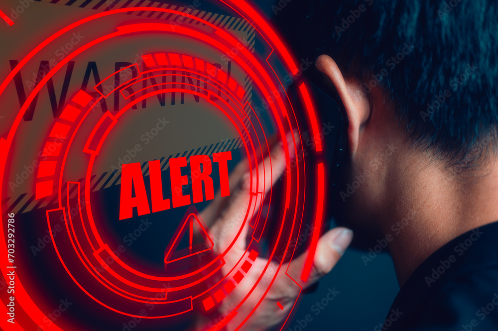man holding mobile phone with alert warning icon showing to be careful ...