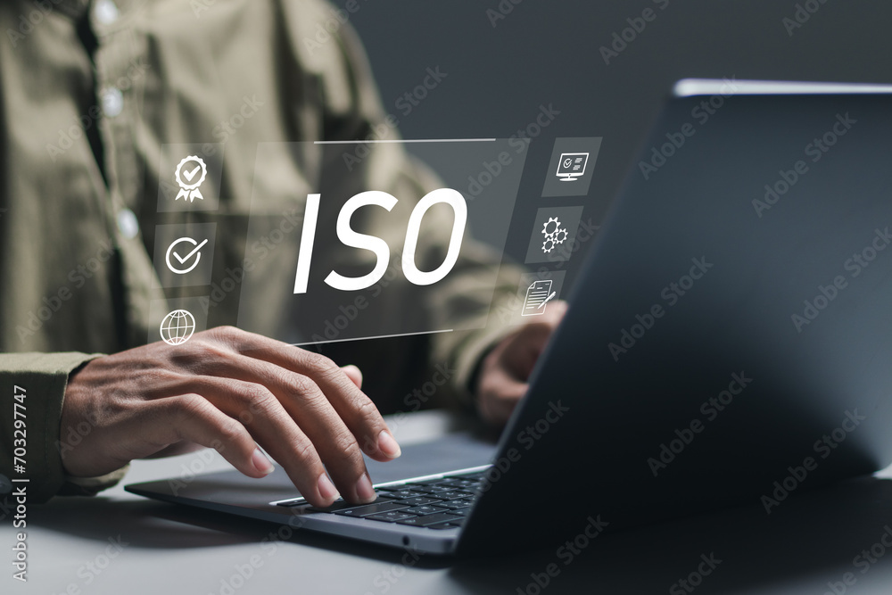 ISO standards quality control. Businessman use laptop with quality ...