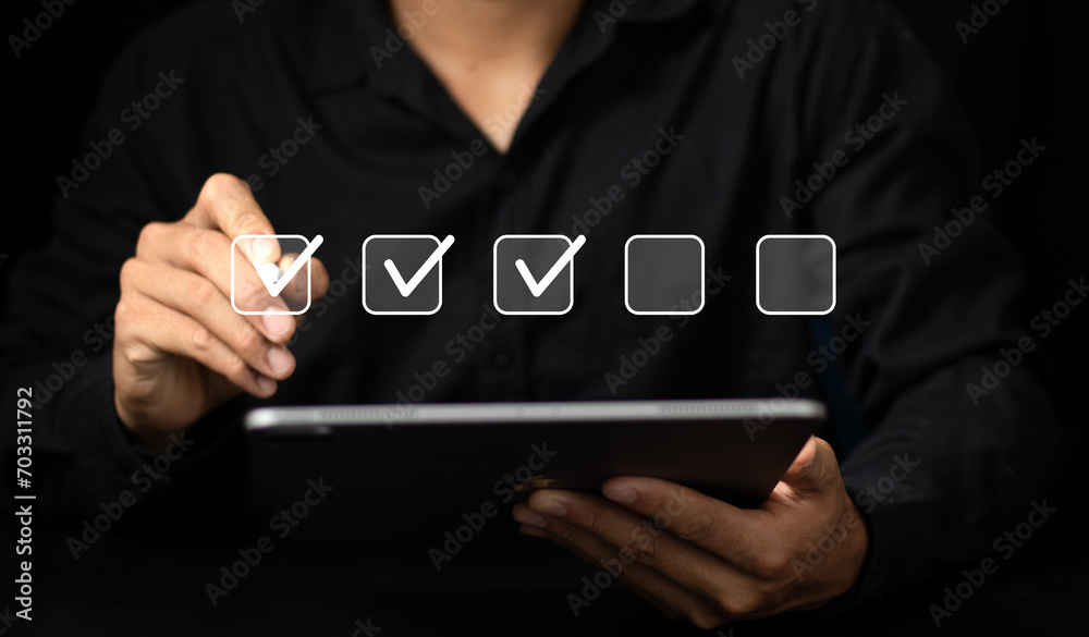 the person ticks the checkmark in the box. concept audit, checklist ...