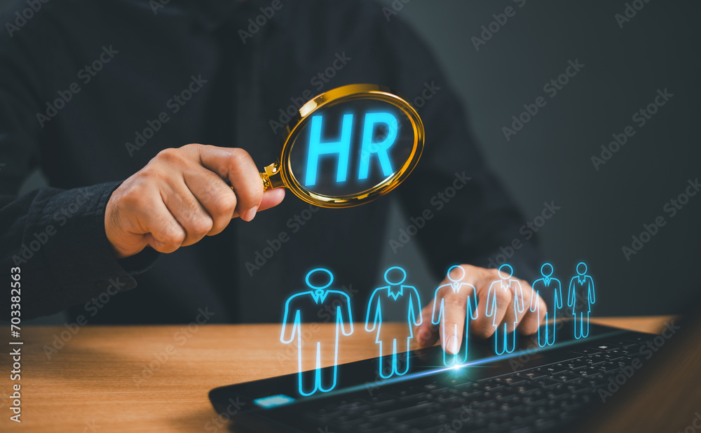 Human Resource Management HRM concept. Businessman use magnifying search human icon cluster for ...