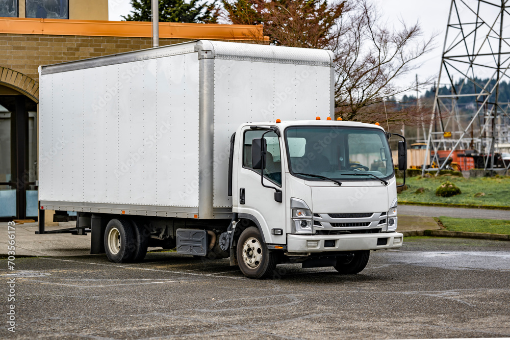 Cab over white compact semi truck with long box trailer deliver cargo ...